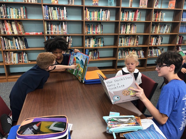 Reading Buddies in Library! – St. Linus School