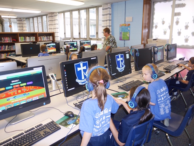 1st and 2nd Graders Learning how to type on computers! – St. Linus School